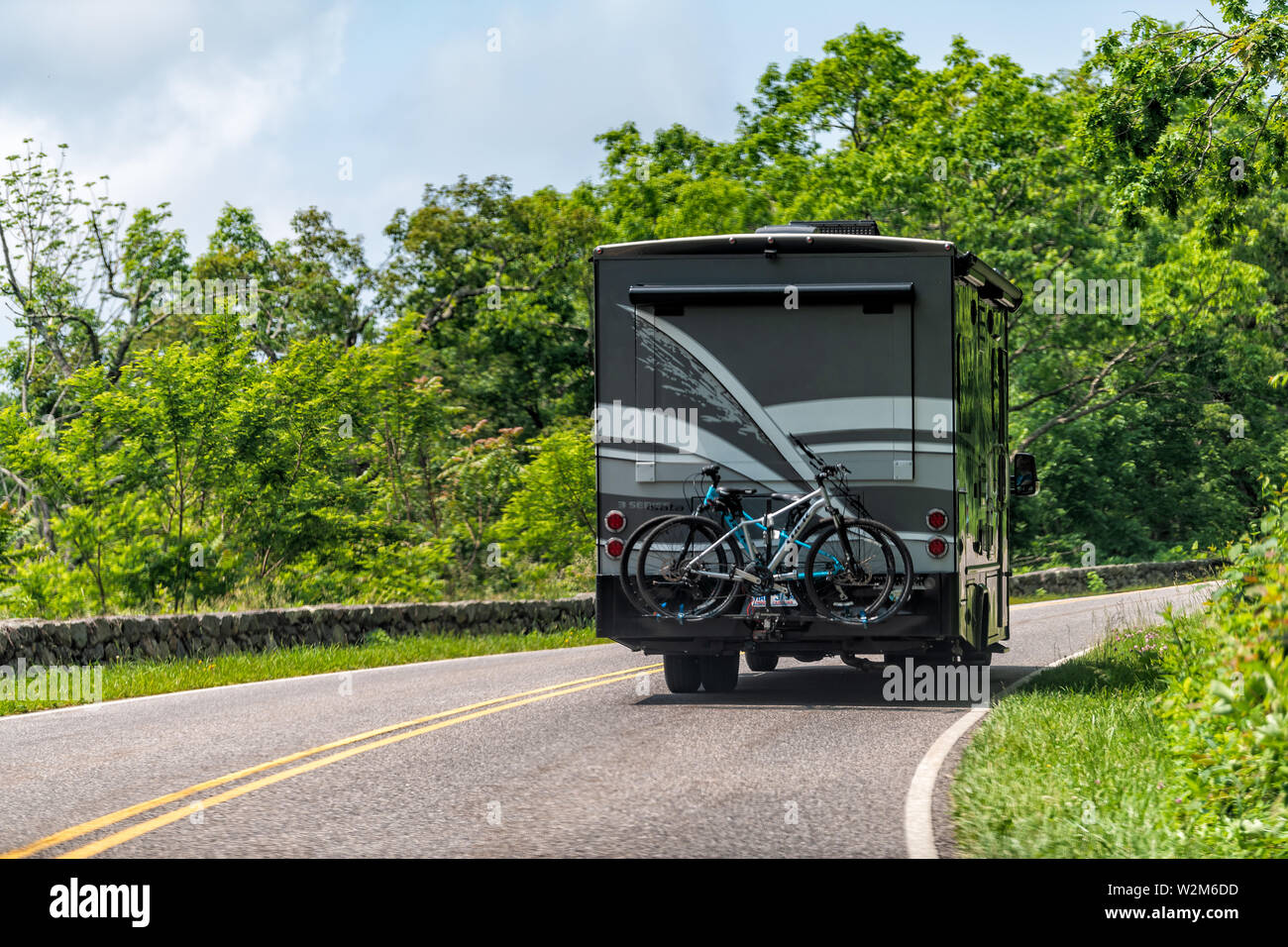 Luray, USA - June 1, 2019: View of road with rv trailer leading to ...