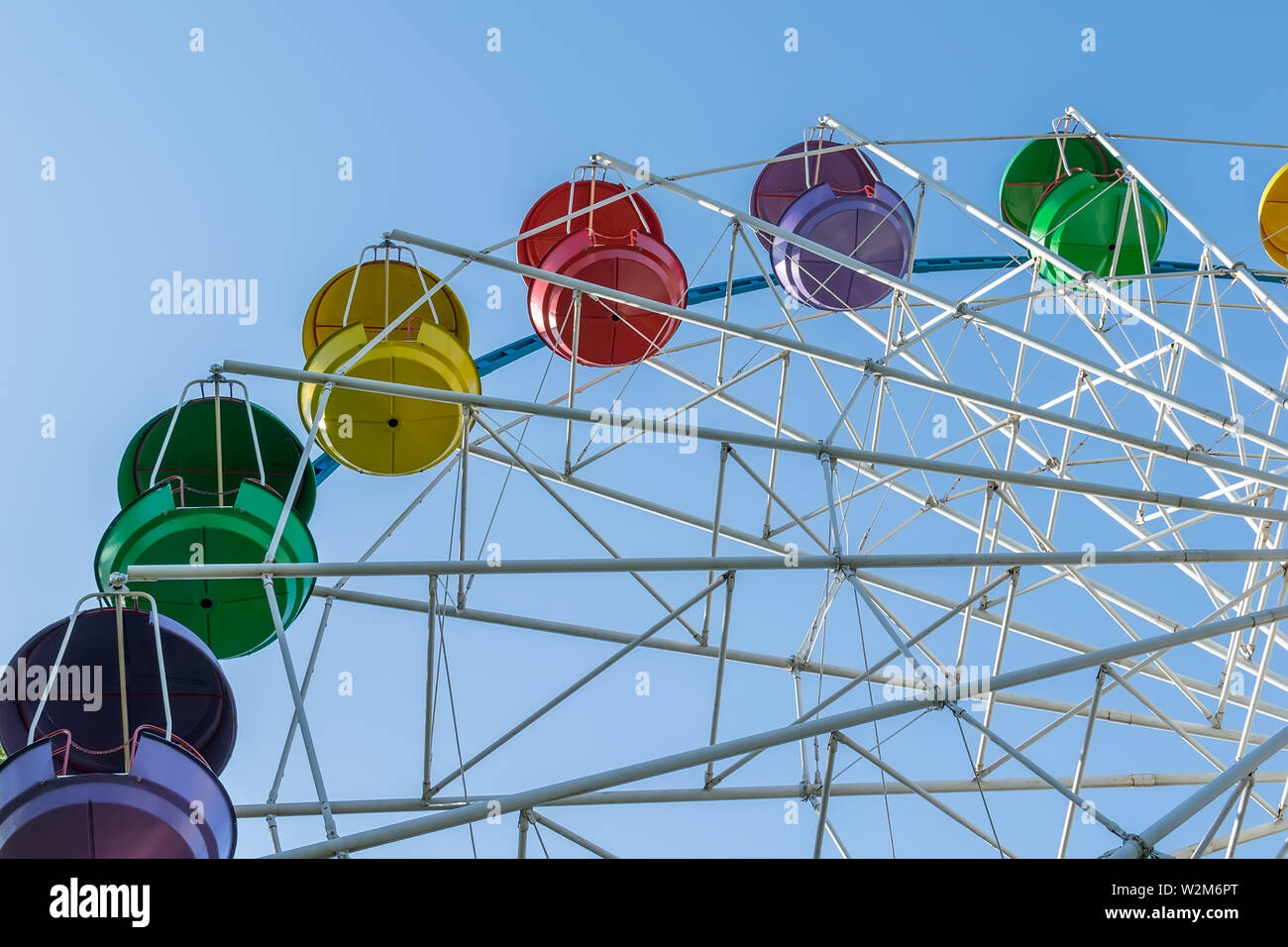 ferris wheel from the amusement Park with colorful baskets of seats ...