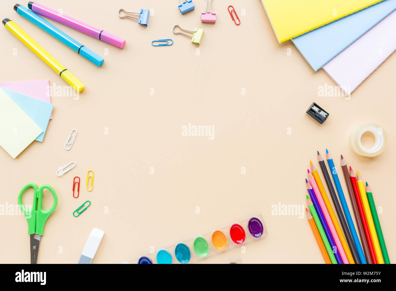 Orange back to school flat lay with bright stationery. School supplies ...
