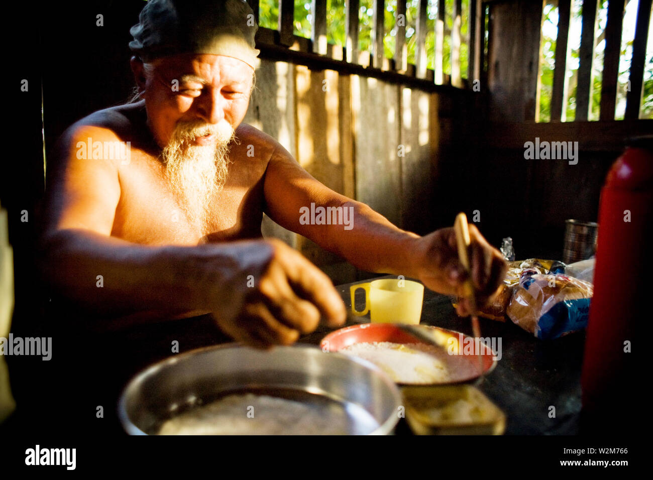 Man Eating Bread, Santa Maria Ranch, Cuieiras River, Manaus, Amazônia ...