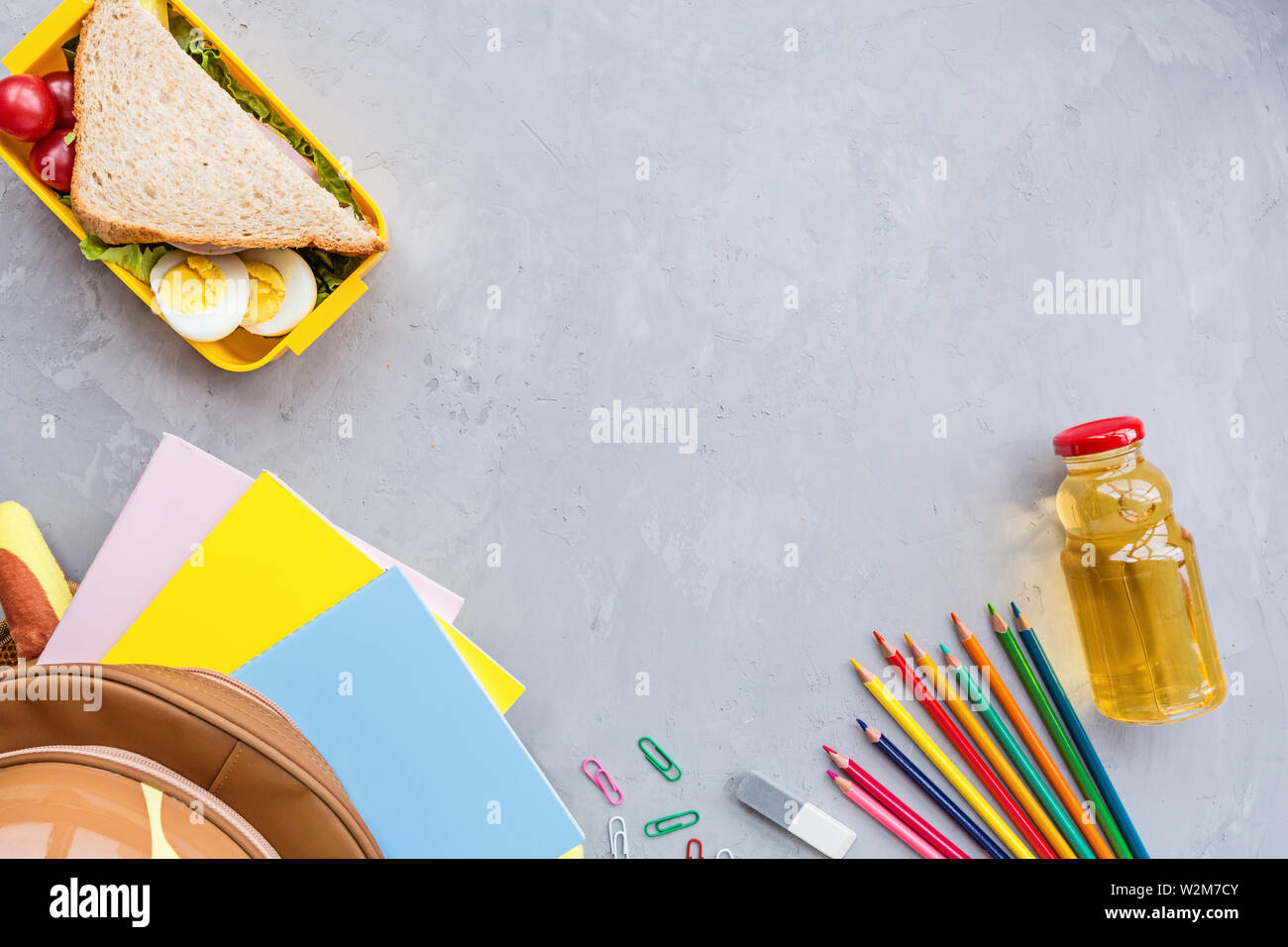 School supplies and lunch box with sandwich and vegetables. Back to ...