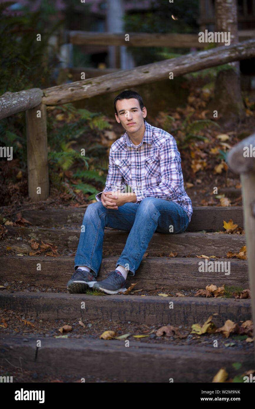 Male On rustic outdoor stairs Stock Photo - Alamy
