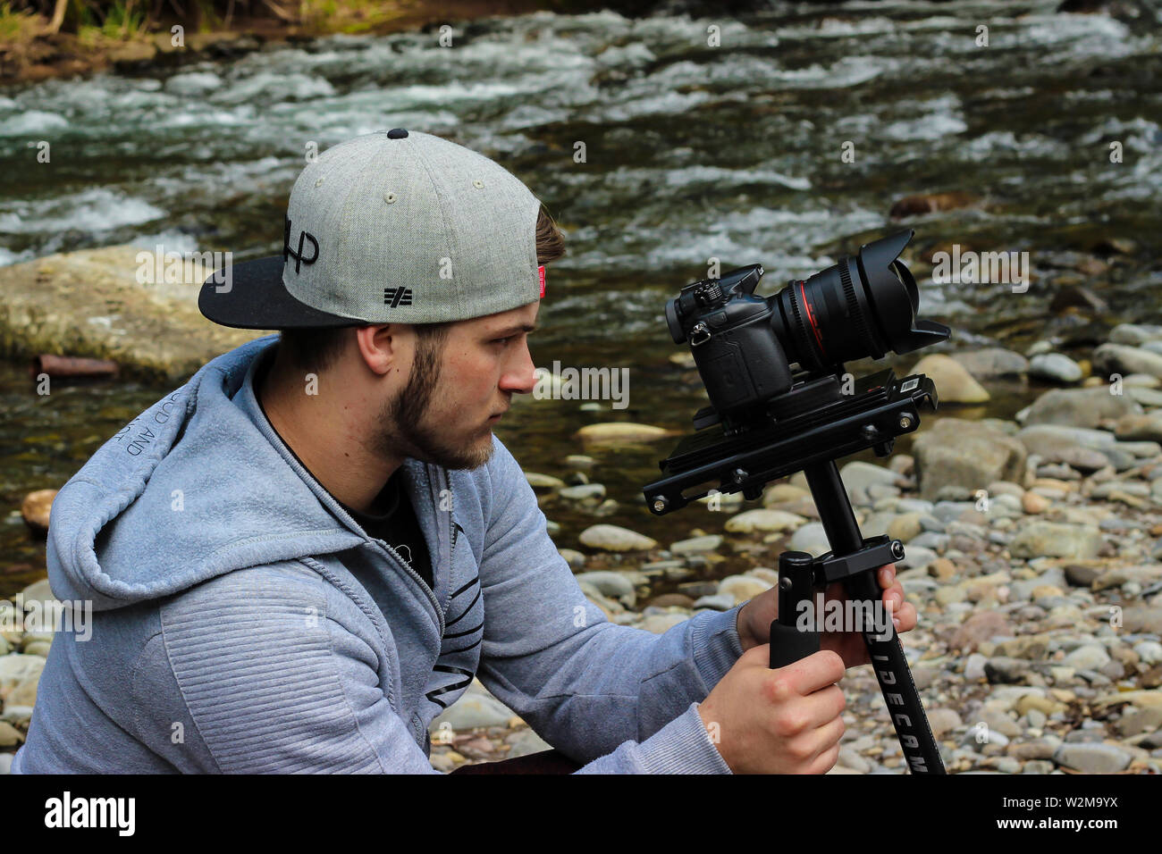 Content creator filming technology hi-res stock photography and images ...