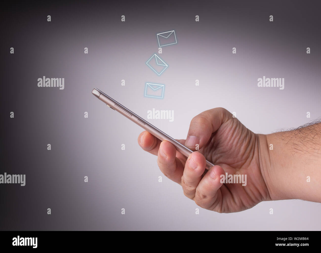 hand sending message with mobile phone Stock Photo - Alamy