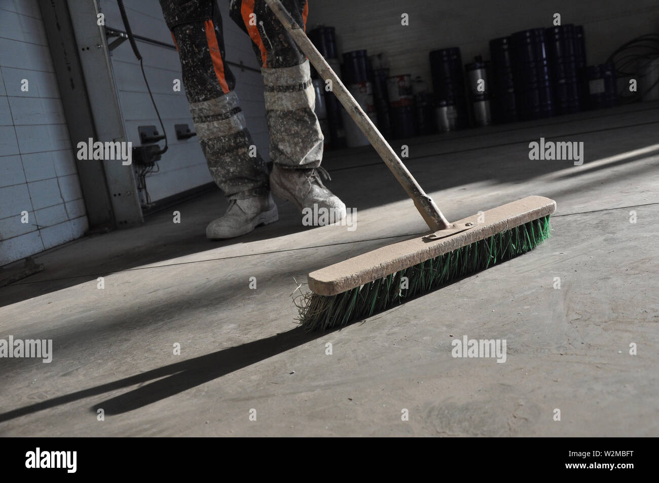 Cleaning of the production room using a brush. Manual cleaning Stock ...