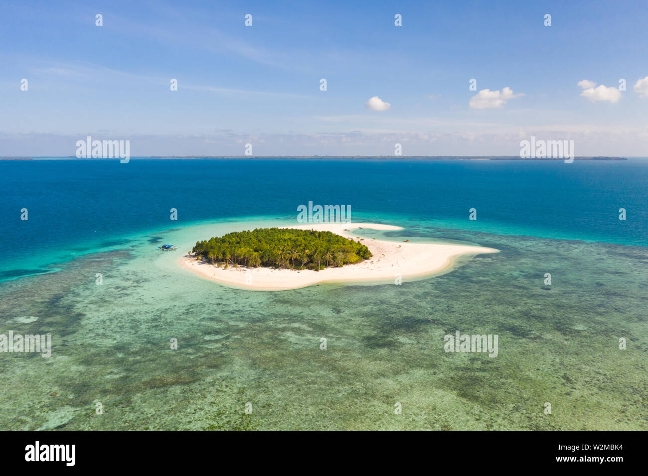 Patawan island. Small tropical island with white sandy beach. Beautiful ...