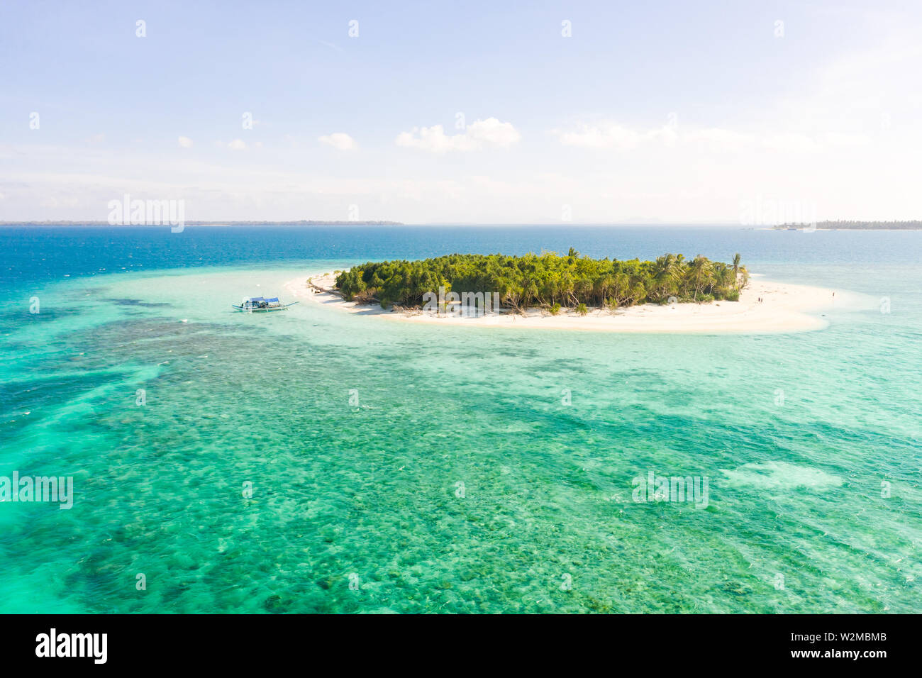 Patawan island. Small tropical island with white sandy beach. Beautiful ...