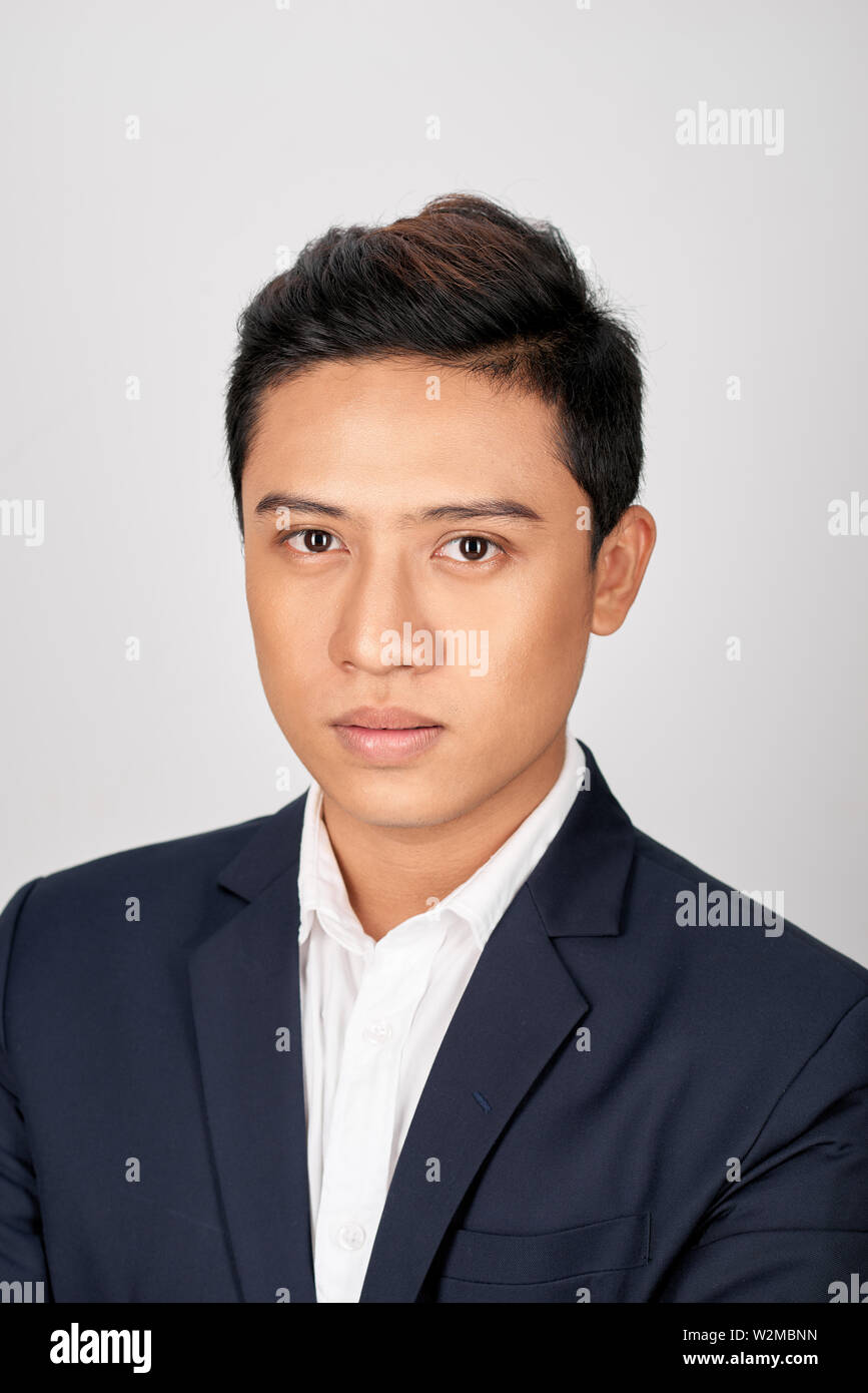 Portrait of serious businessman in suite on white background Stock ...