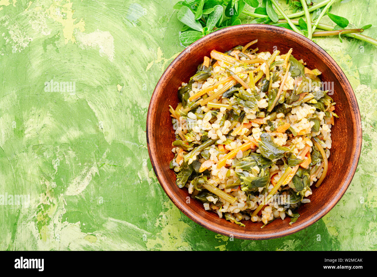 Popular food of the Middle East.Stew bulgur.Bulgur with portulak Stock ...