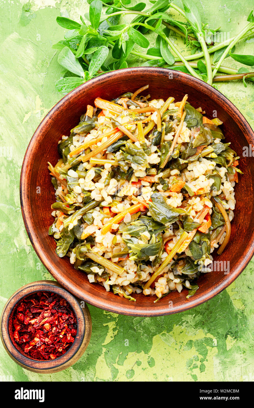 Popular food of the Middle East.Stew bulgur.Bulgur with portulak Stock ...