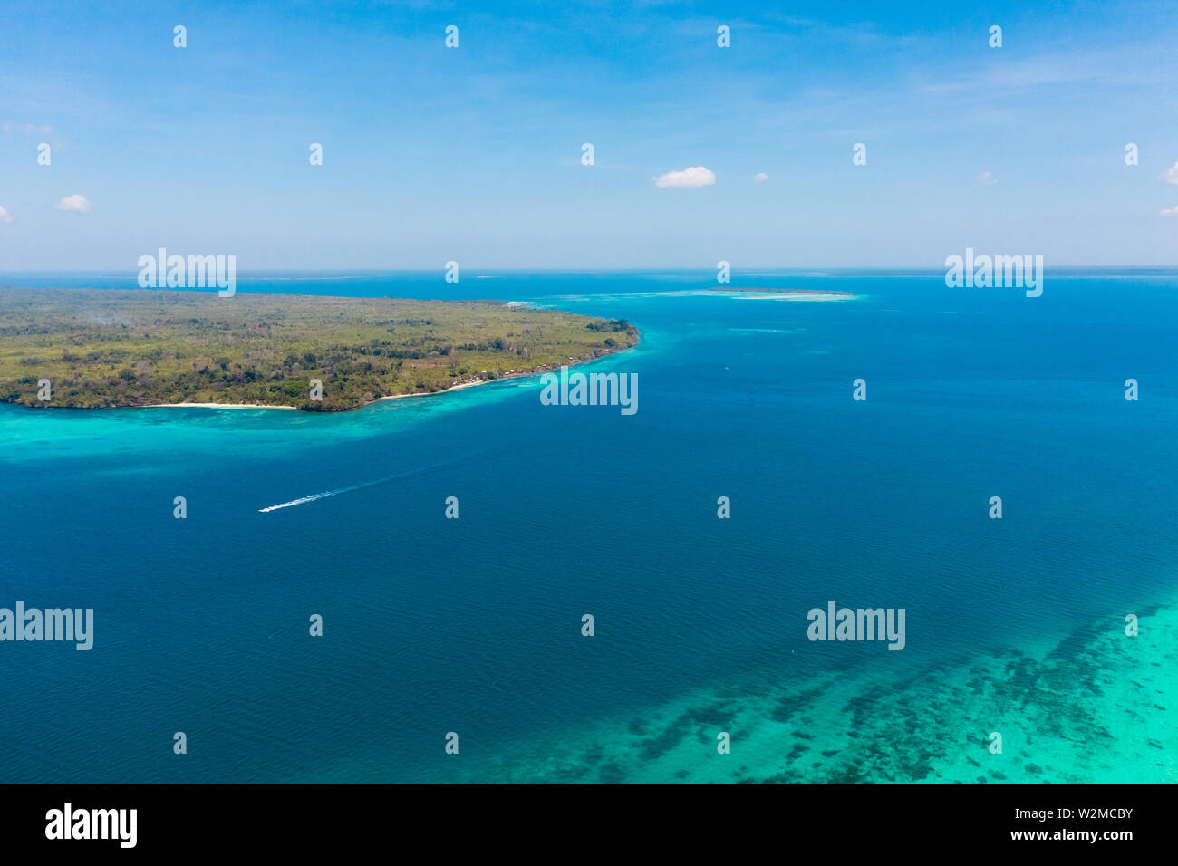Large islands located on the atolls, a top view. Island with forest ...