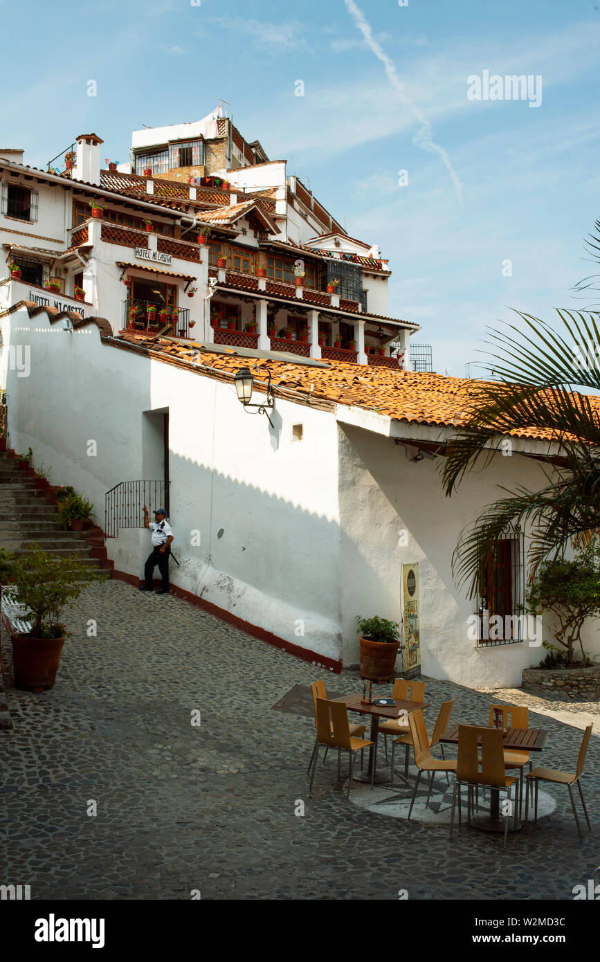 Street view with white houses in the historic center of Taxco, Magical ...