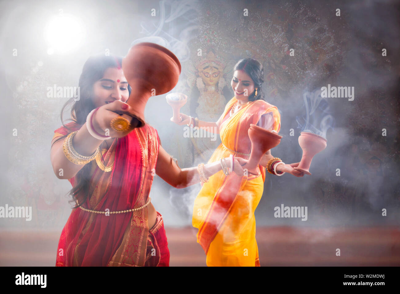 Two Married bengali women performing dhunuchi dance on the occasion of ...