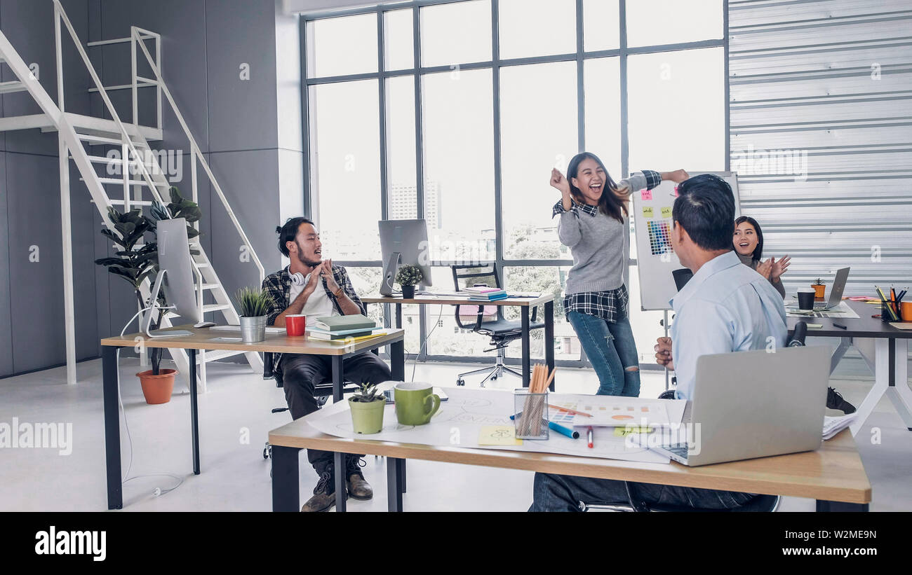 creative designer dancing in office, get good new about promote to ...