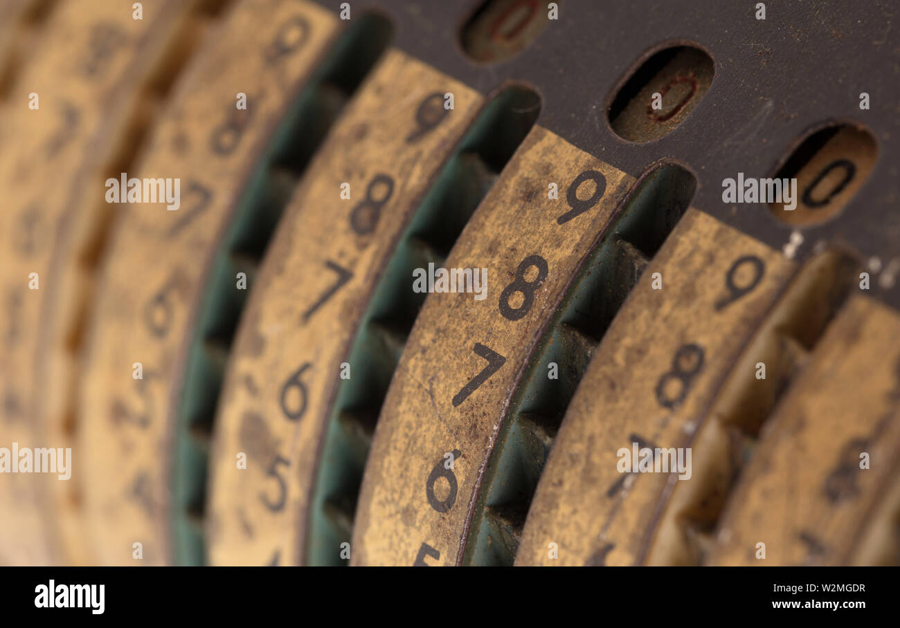 Vintage manual adding machine isolated, selective focus Stock Photo - Alamy