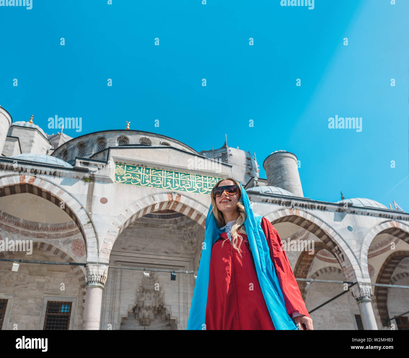 Attractive beautiful girl with covered clothes poses in front of Sultan ...