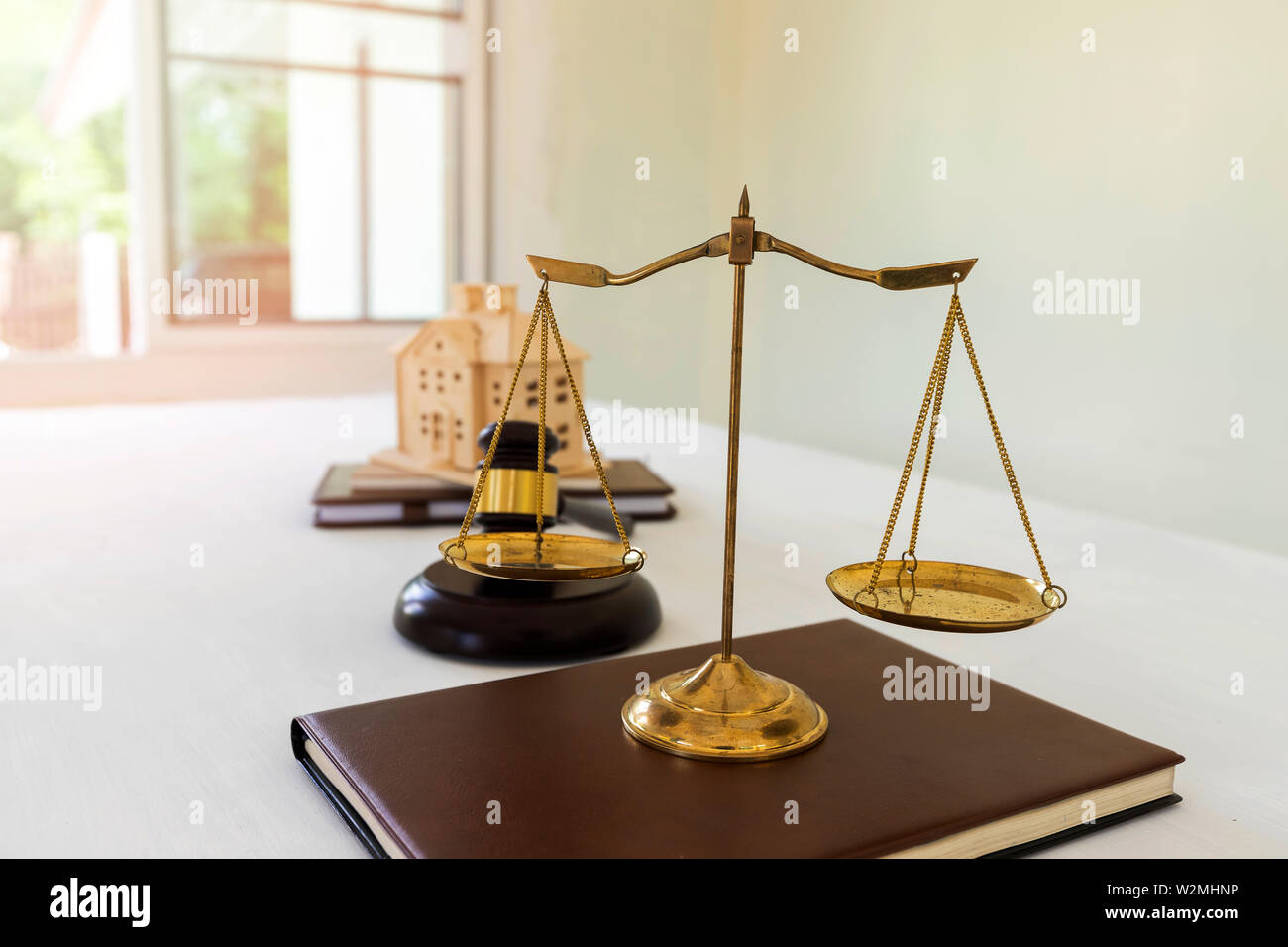 Gold brass balance scale isolated on book, Symbol of law and justice ...