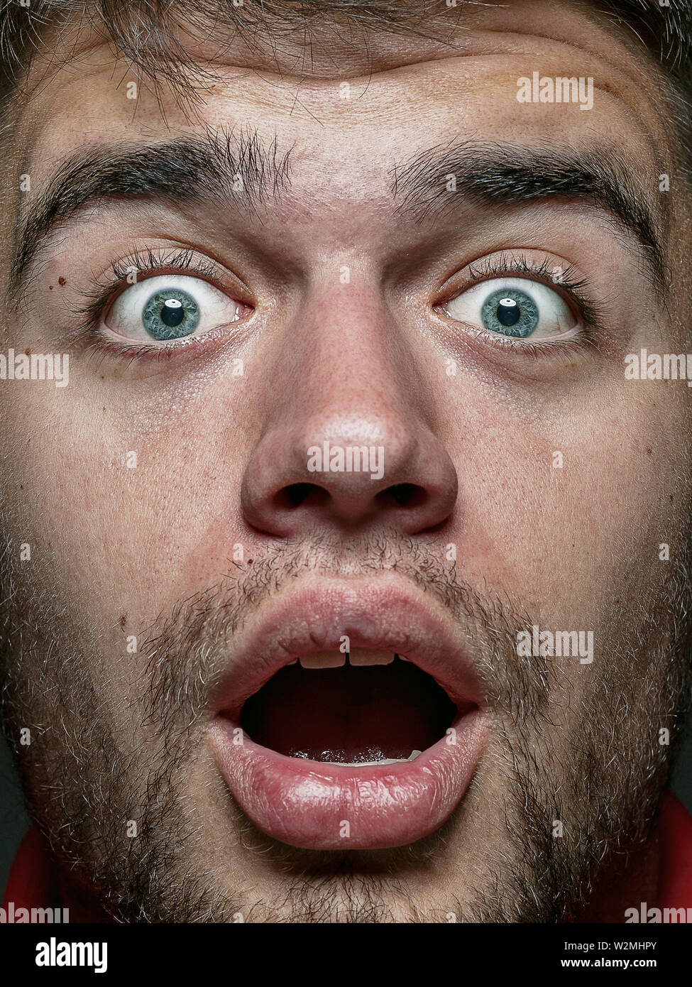 Close up portrait of young and emotional caucasian man. Highly detail ...