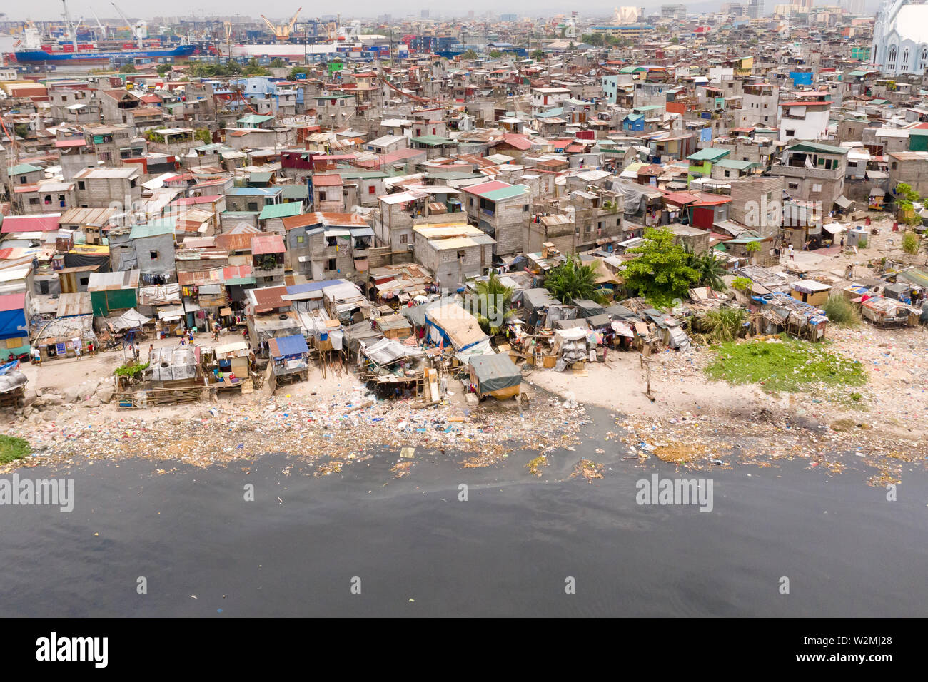 Slums in Manila, a top view. Sea pollution by household waste. Plastic ...