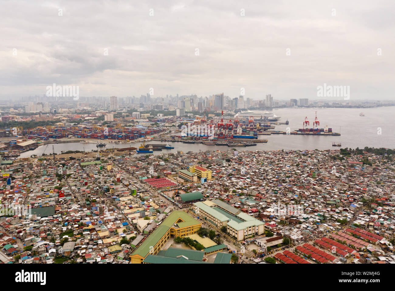 Port in Manila, Philippines. Sea port with cargo cranes. Cityscape with ...
