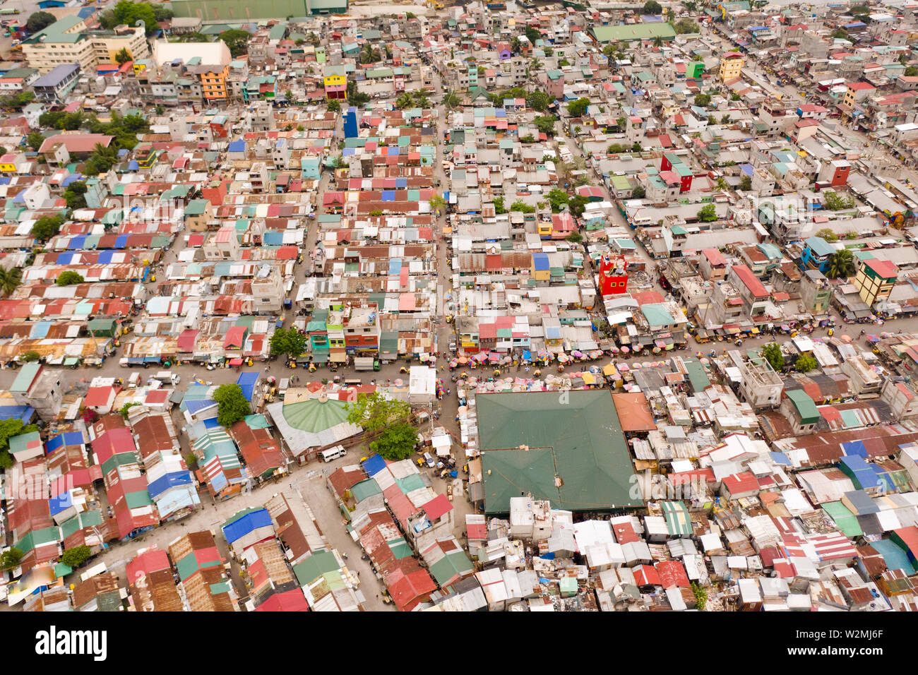 Streets of poor areas in Manila. The roofs of houses and the life of ...