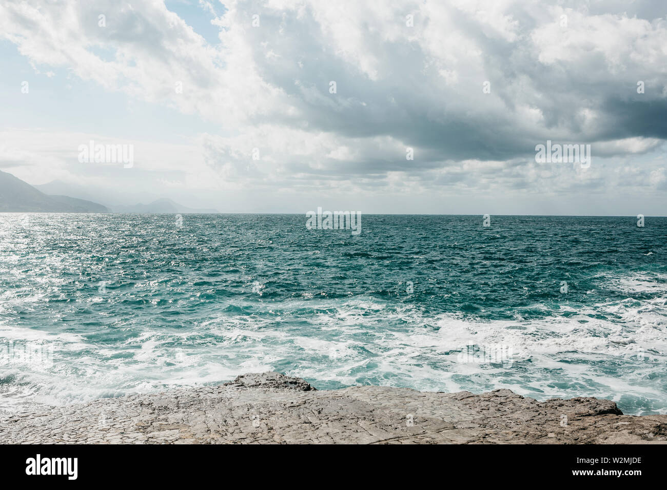 Beautiful view of the restless sea near the stone coast. Natural ...