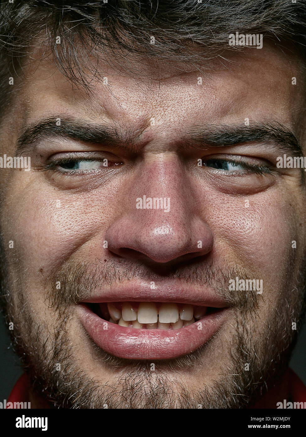 Close up portrait of young and emotional caucasian man. Highly detail ...