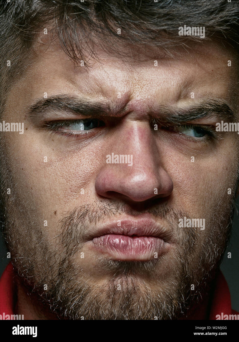 Close up portrait of young and emotional caucasian man. Highly detail ...