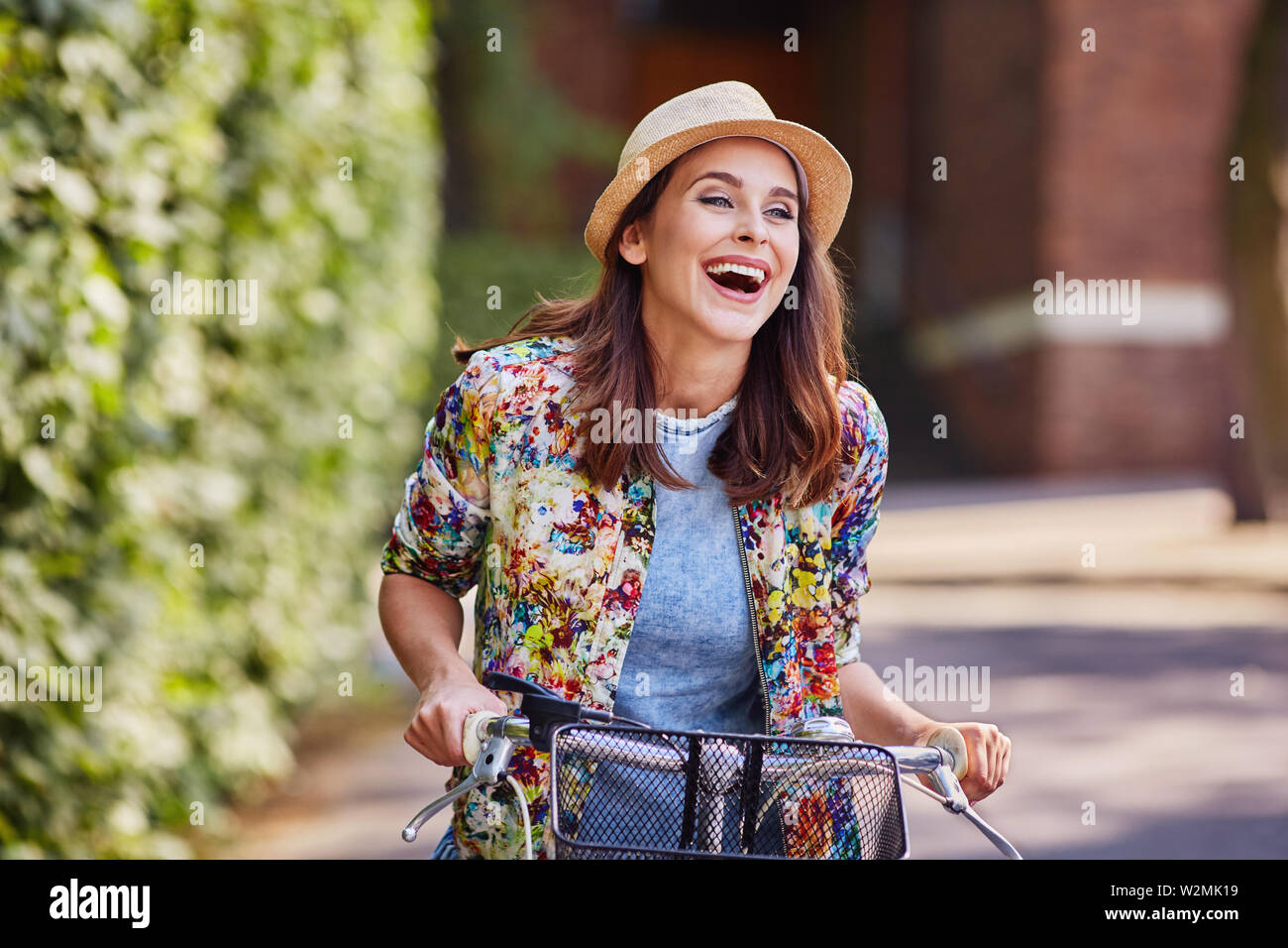 Young woman riding bike model hi-res stock photography and images - Alamy