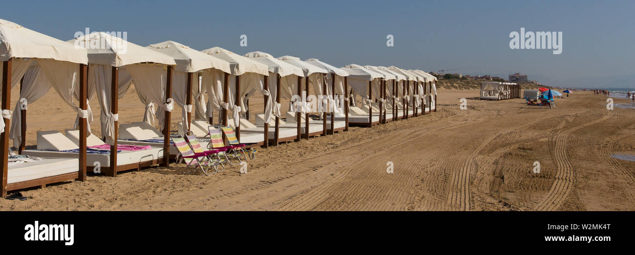 Luxury beach beds for two with white roof and sides like a tent ...