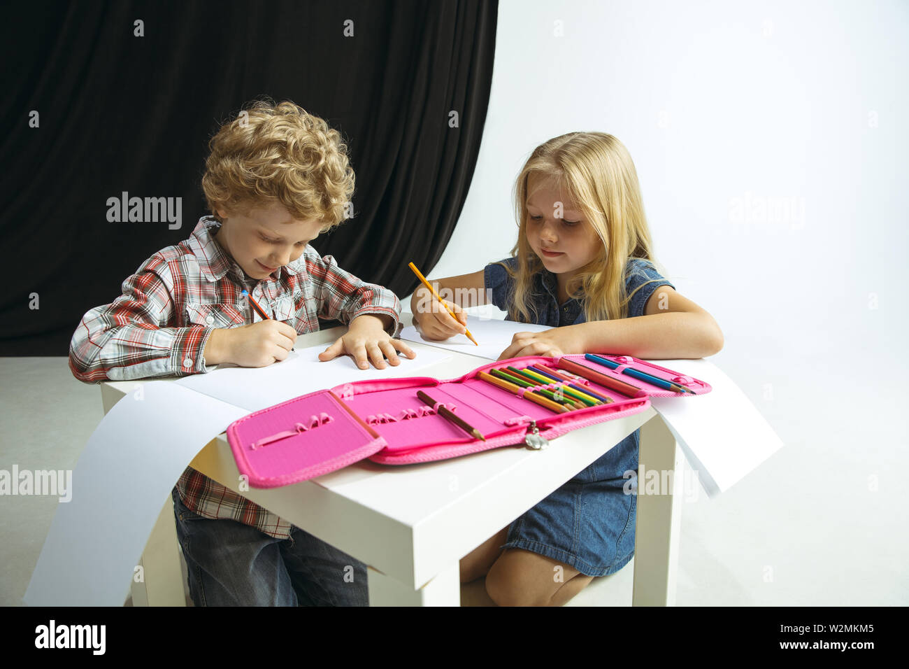 Boy and girl preparing for school after a long summer break. Back to ...