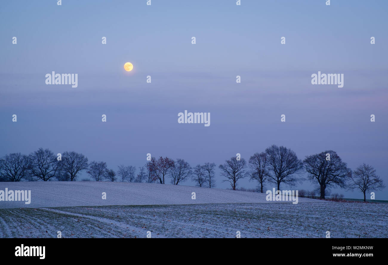 Full moon over snowy landscape hi-res stock photography and images - Alamy