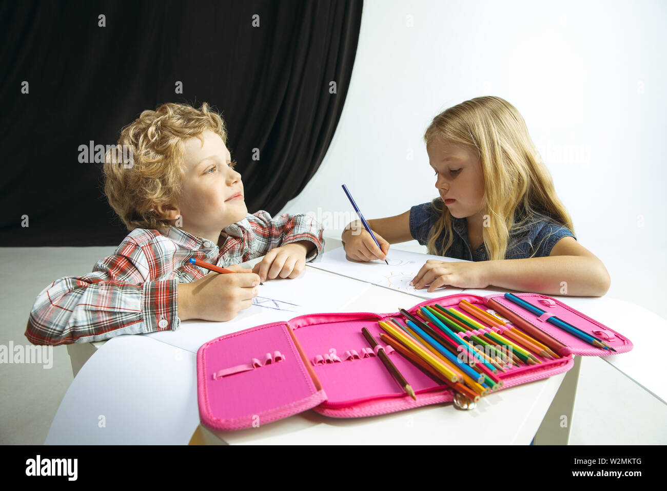 Boy and girl preparing for school after a long summer break. Back to ...