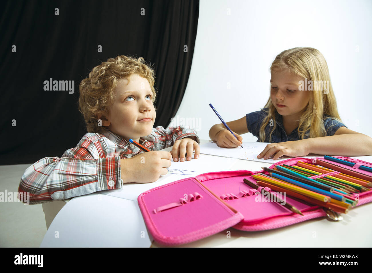 Boy and girl preparing for school after a long summer break. Back to ...