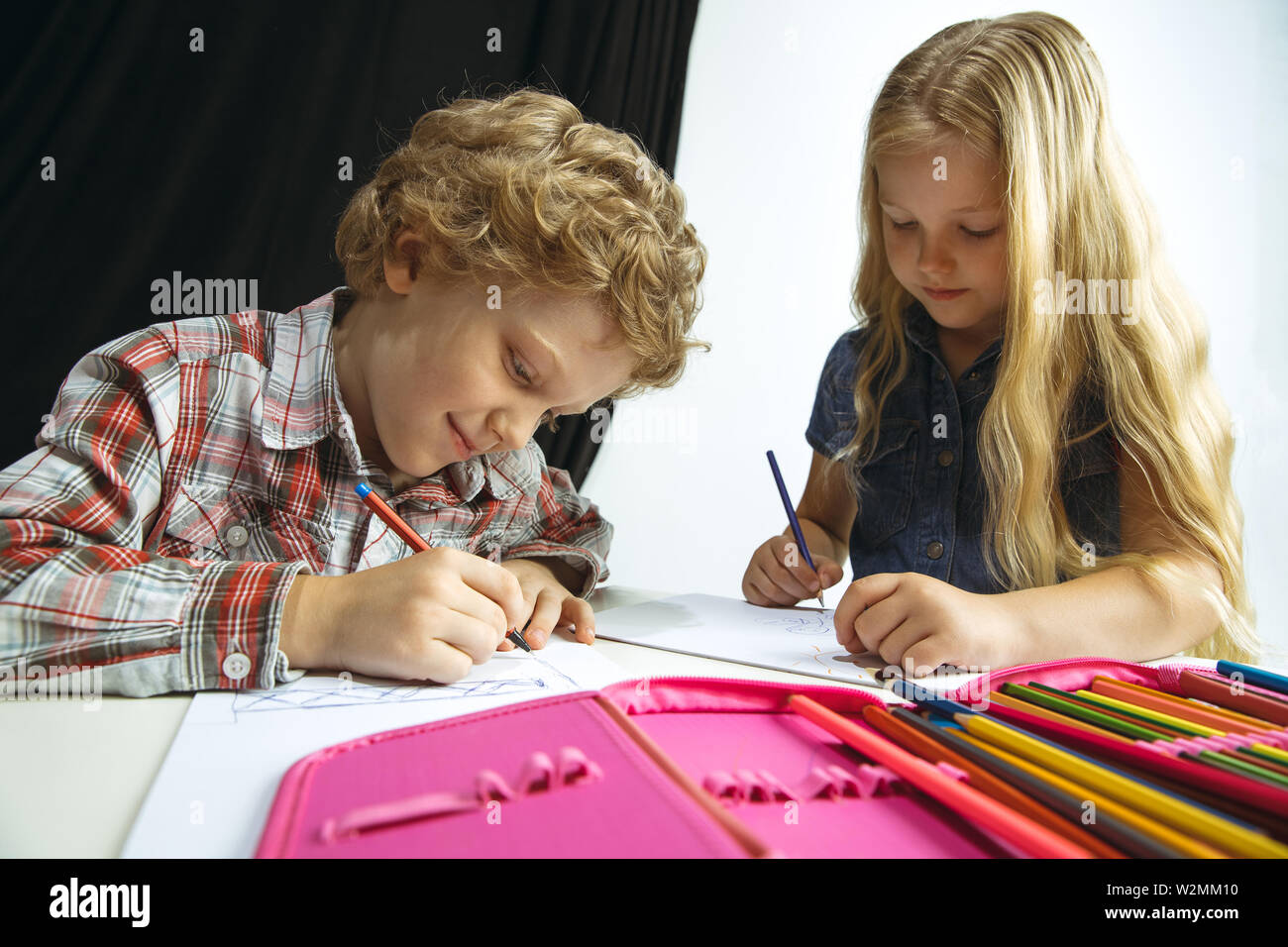 Boy and girl preparing for school after a long summer break. Back to ...