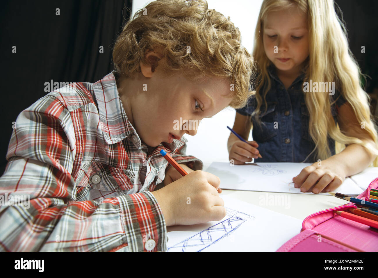 Boy and girl preparing for school after a long summer break. Back to ...