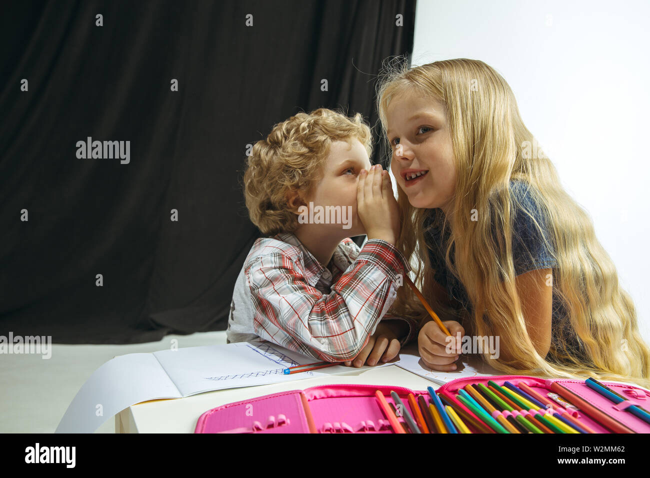 Boy and girl preparing for school after a long summer break. Back to ...