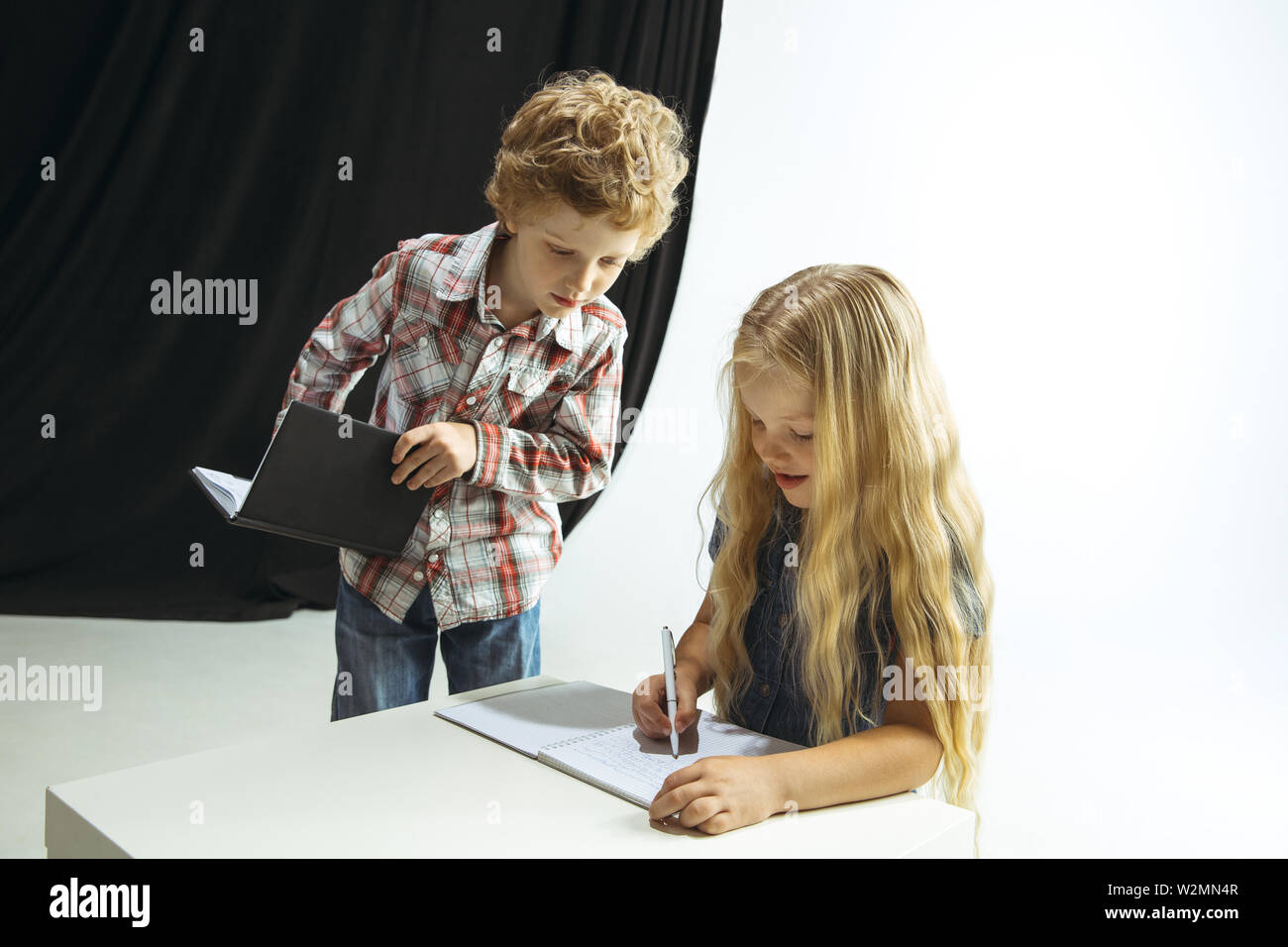 Boy and girl preparing for school after a long summer break. Back to ...