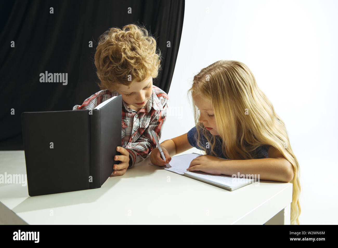 Boy and girl preparing for school after a long summer break. Back to ...