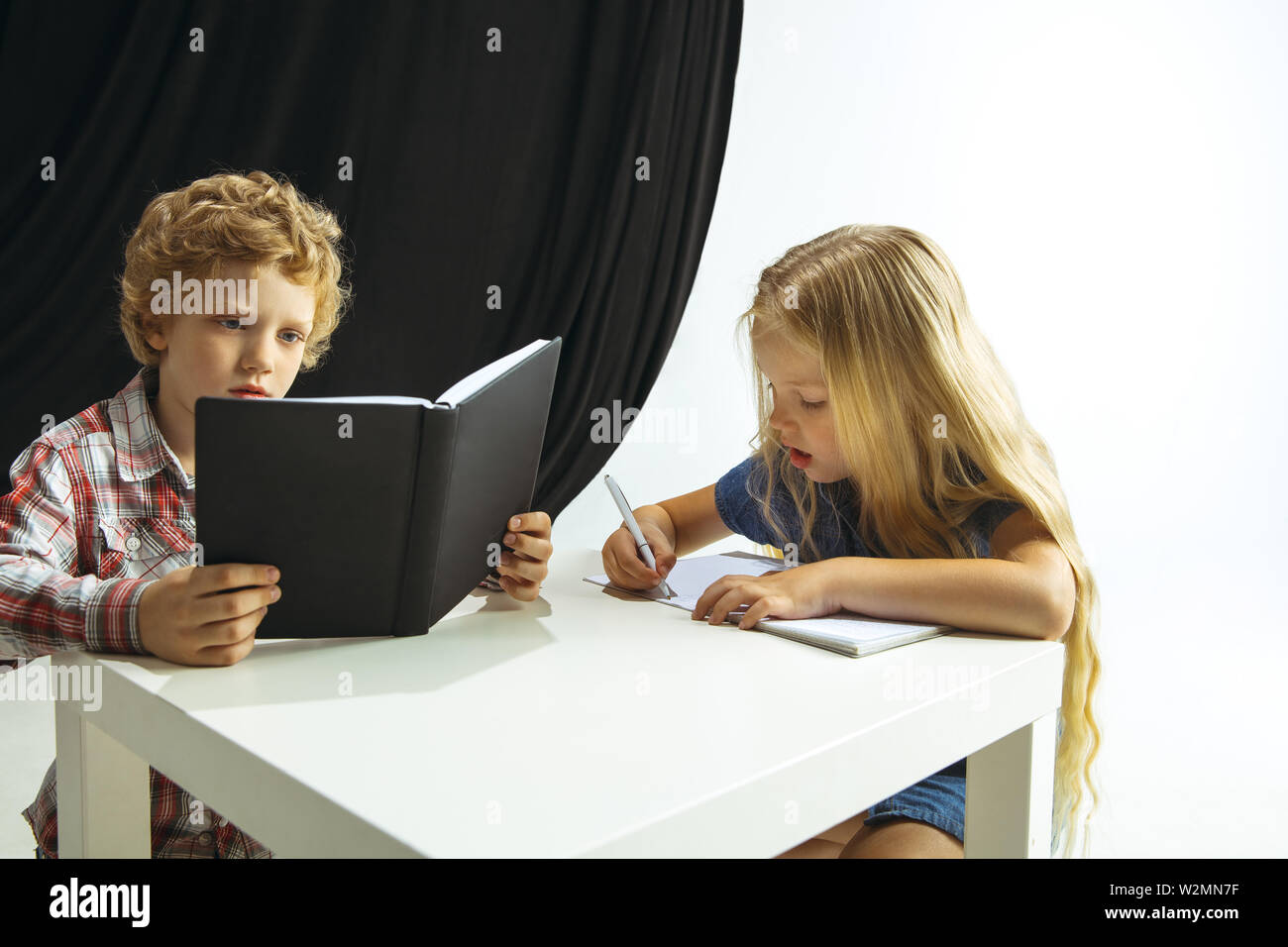 Boy and girl preparing for school after a long summer break. Back to ...