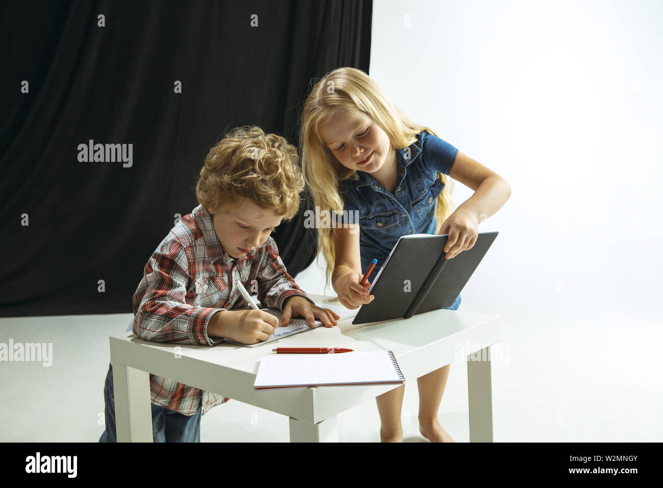 Boy and girl preparing for school after a long summer break. Back to ...