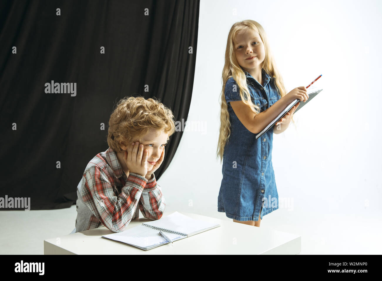 Boy and girl preparing for school after a long summer break. Back to ...