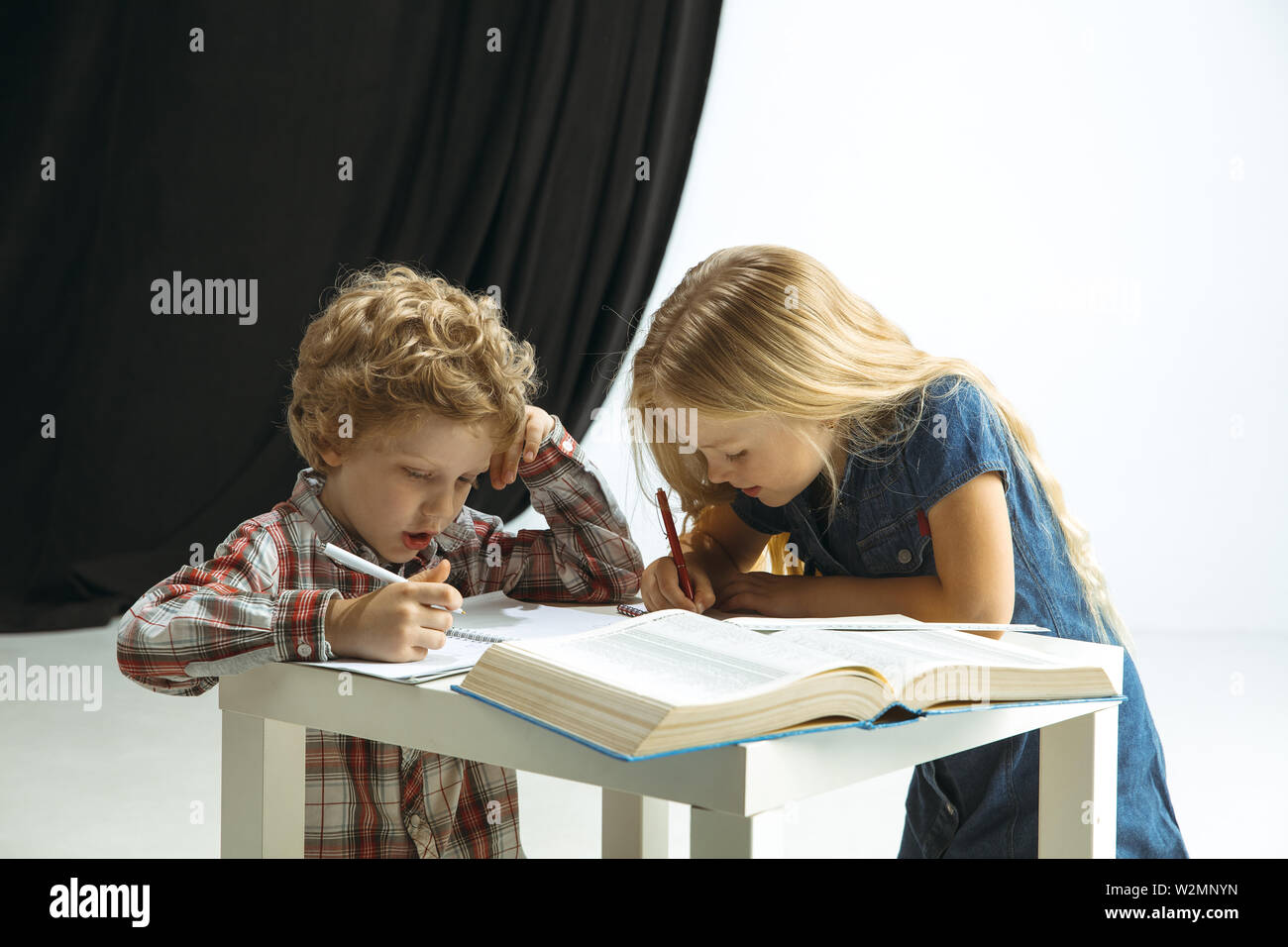 Boy and girl preparing for school after a long summer break. Back to ...