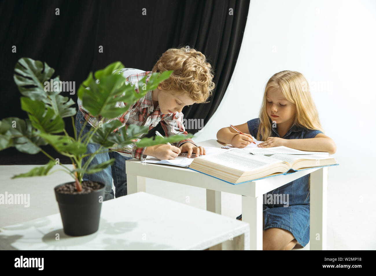 Boy and girl preparing for school after a long summer break. Back to ...