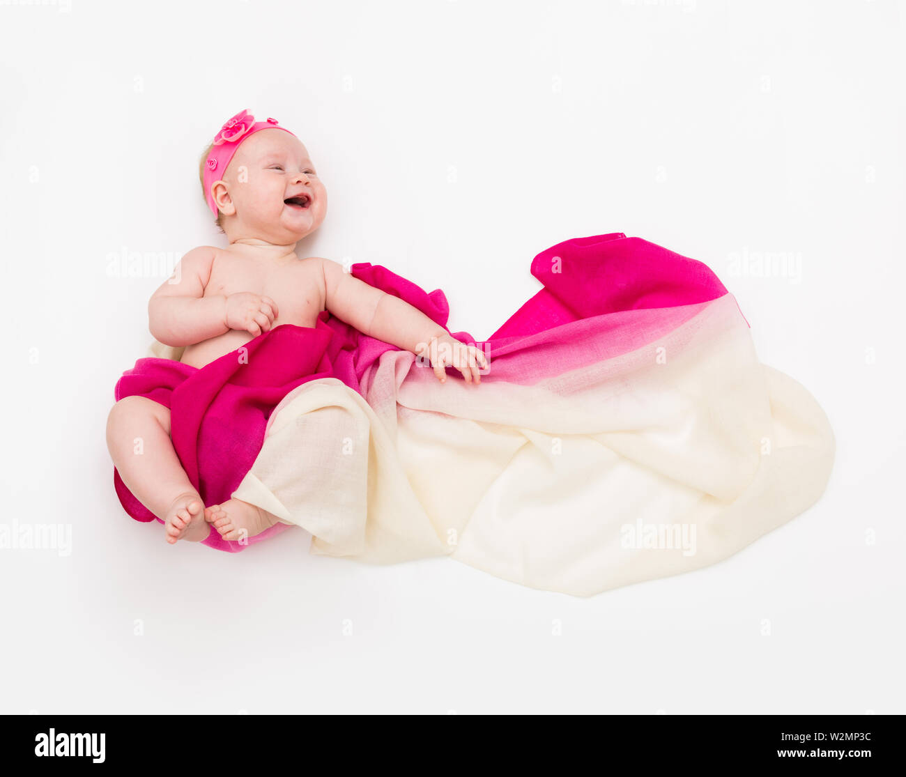 Top view of cute laughing baby girl dressed in a fairy costume ...