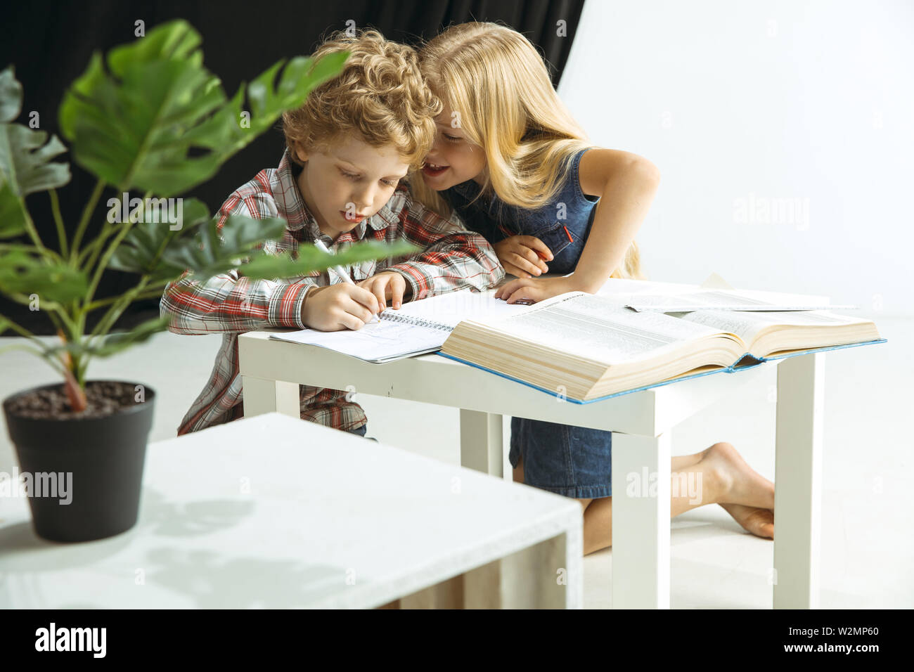 Boy and girl preparing for school after a long summer break. Back to ...