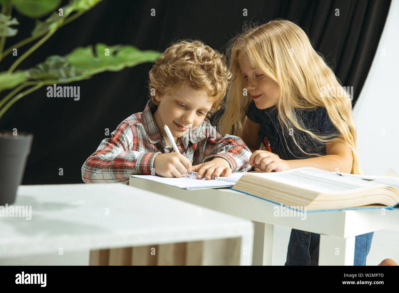 Boy and girl preparing for school after a long summer break. Back to ...