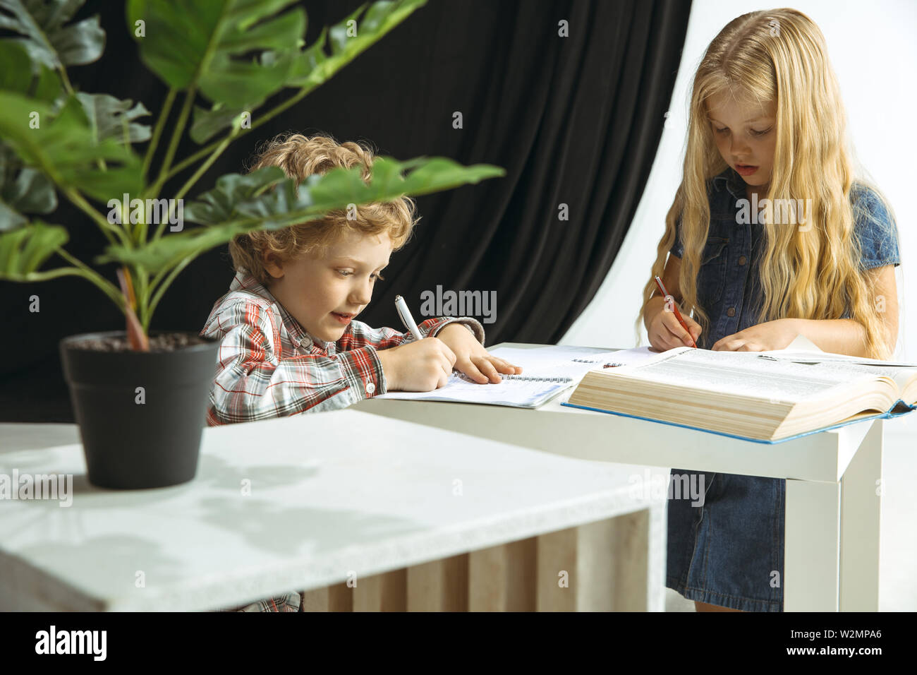 Boy and girl preparing for school after a long summer break. Back to ...