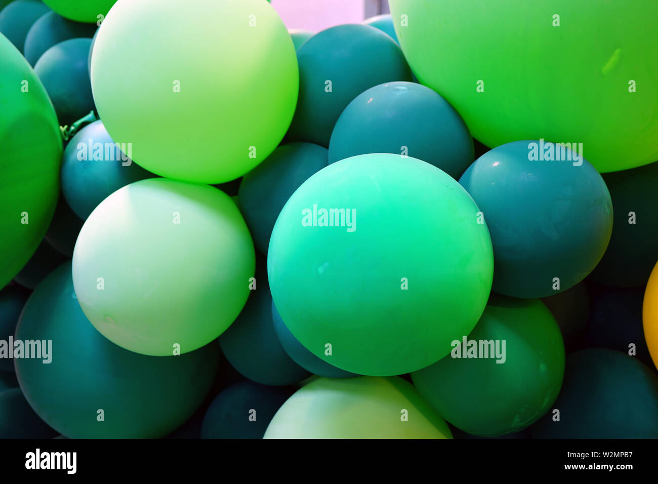 Colorful green and multicolor balloons at a party Stock Photo - Alamy