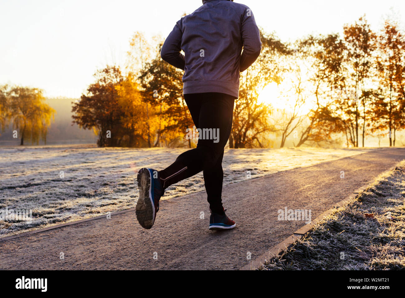 Man jogging at sunrise hi-res stock photography and images - Alamy